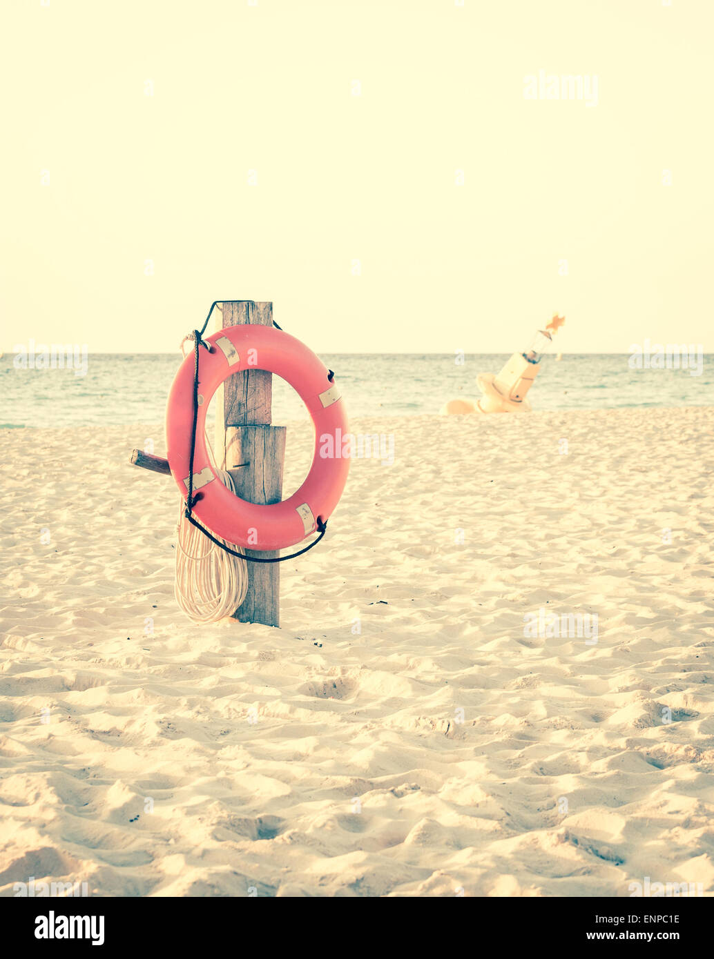 Life preserver on sandy beach somewhere in Mexico Stock Photo - Alamy