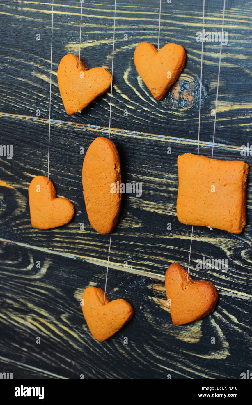 delicious cookies in the shape of hearts, oval, square on strings Stock ...