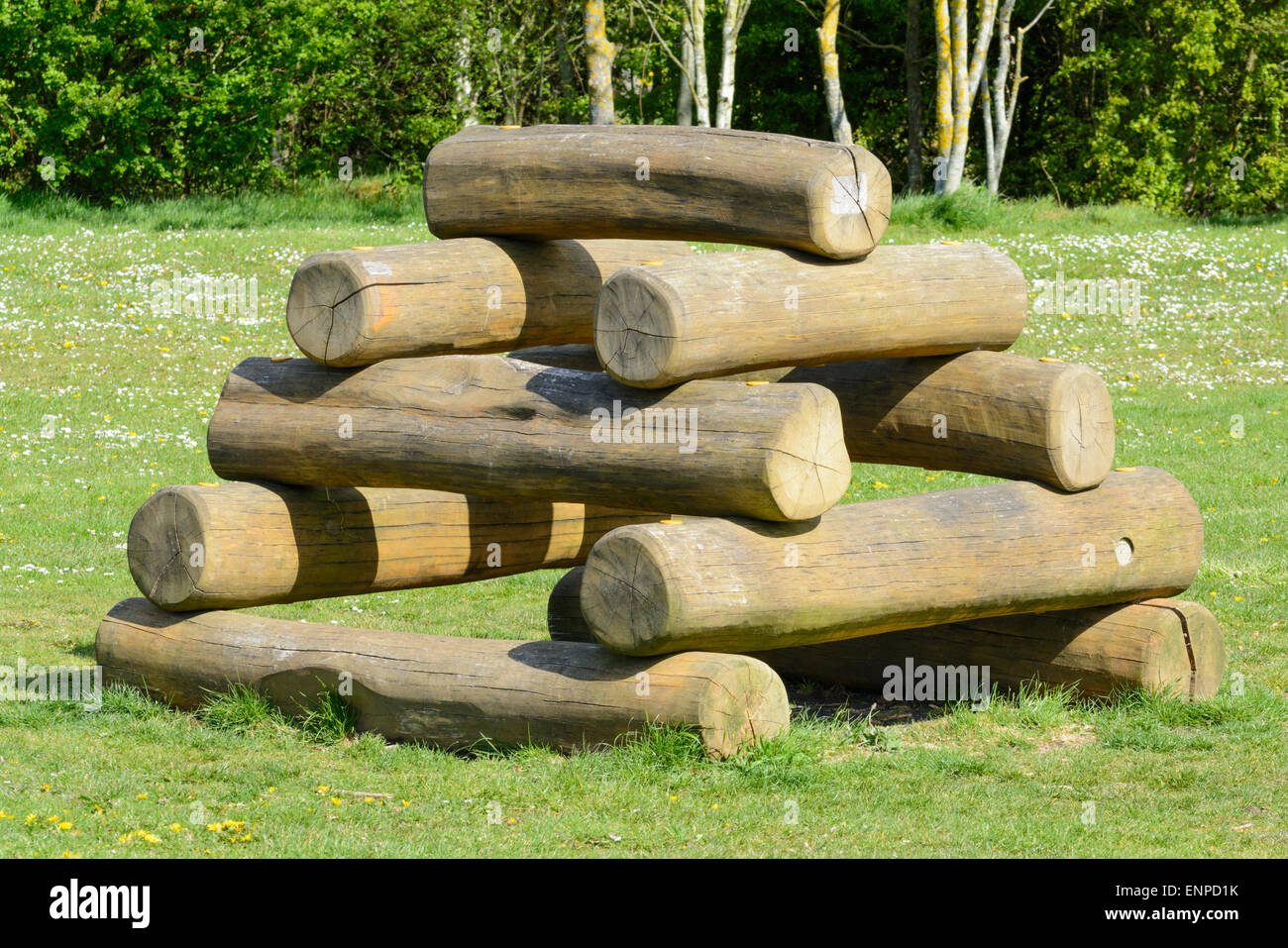 Wooden log climbing apparatus in a park Stock Photo - Alamy