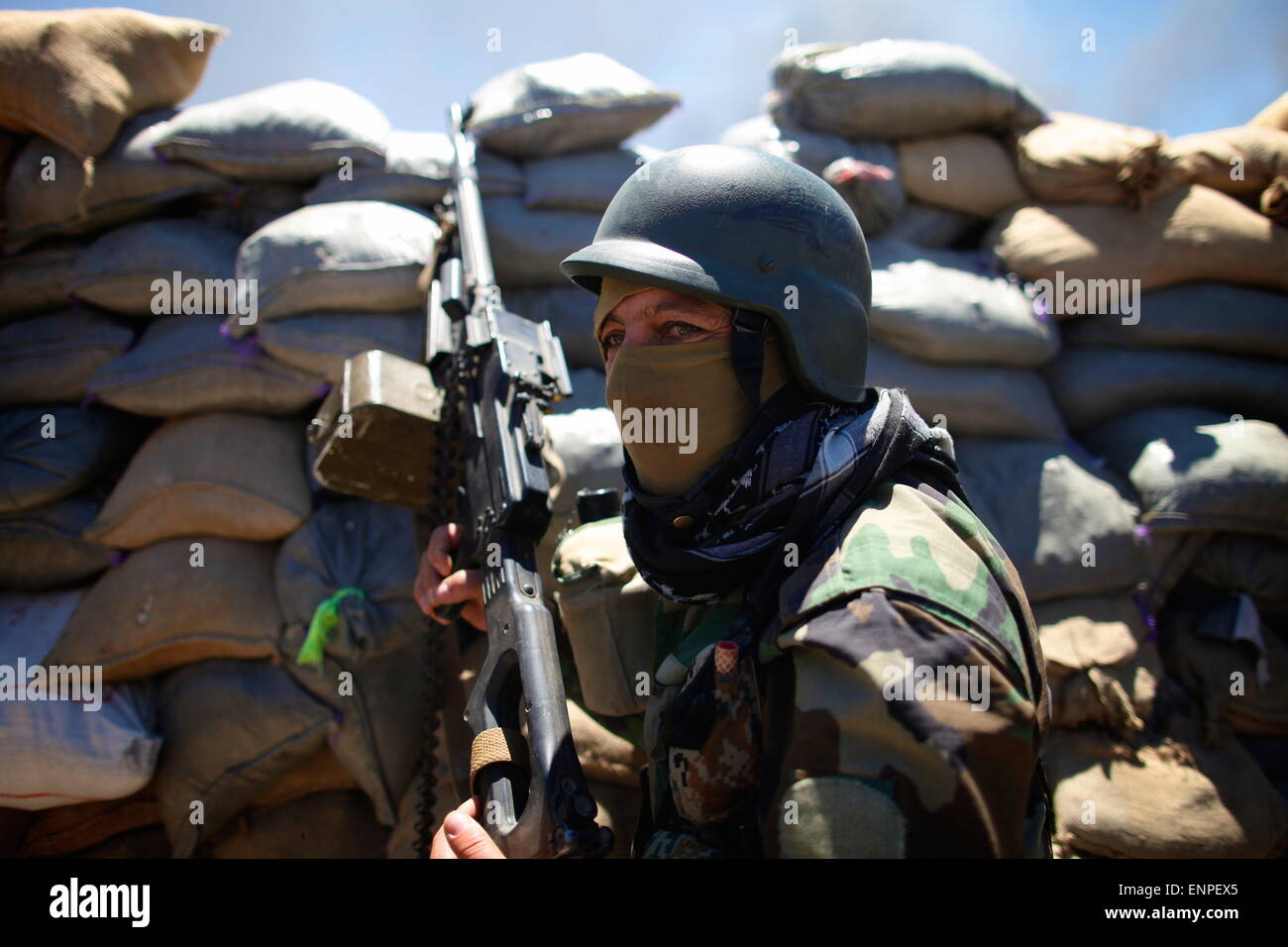 Shingal, Iraq. 7th May, 2015. Peshmerga squad gunner breaks and waits ...
