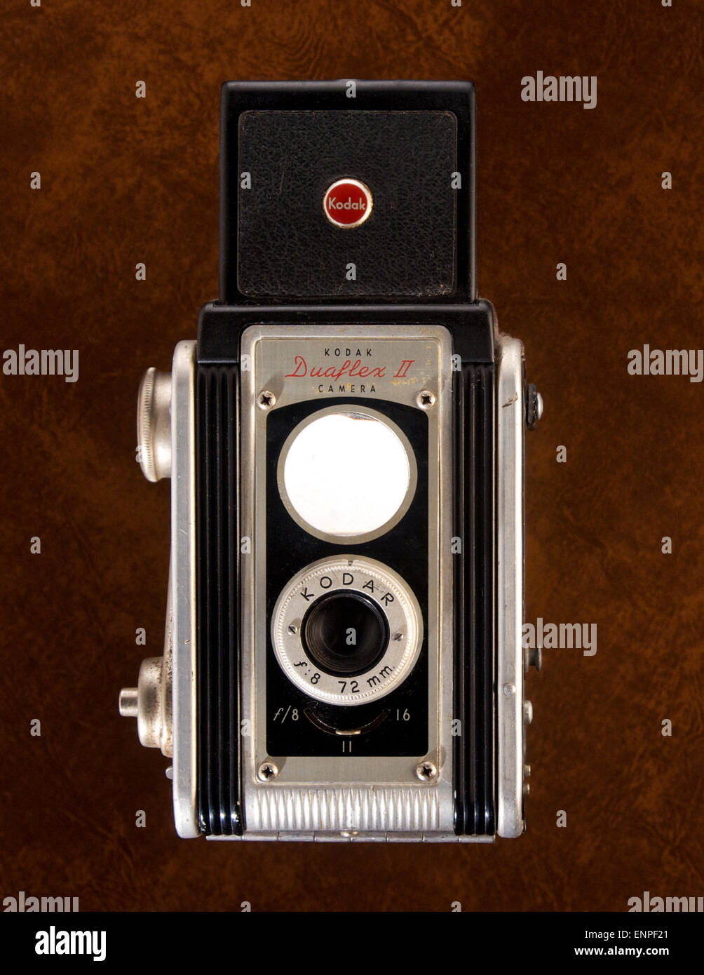 Vintage camera on brown leather background Stock Photo - Alamy