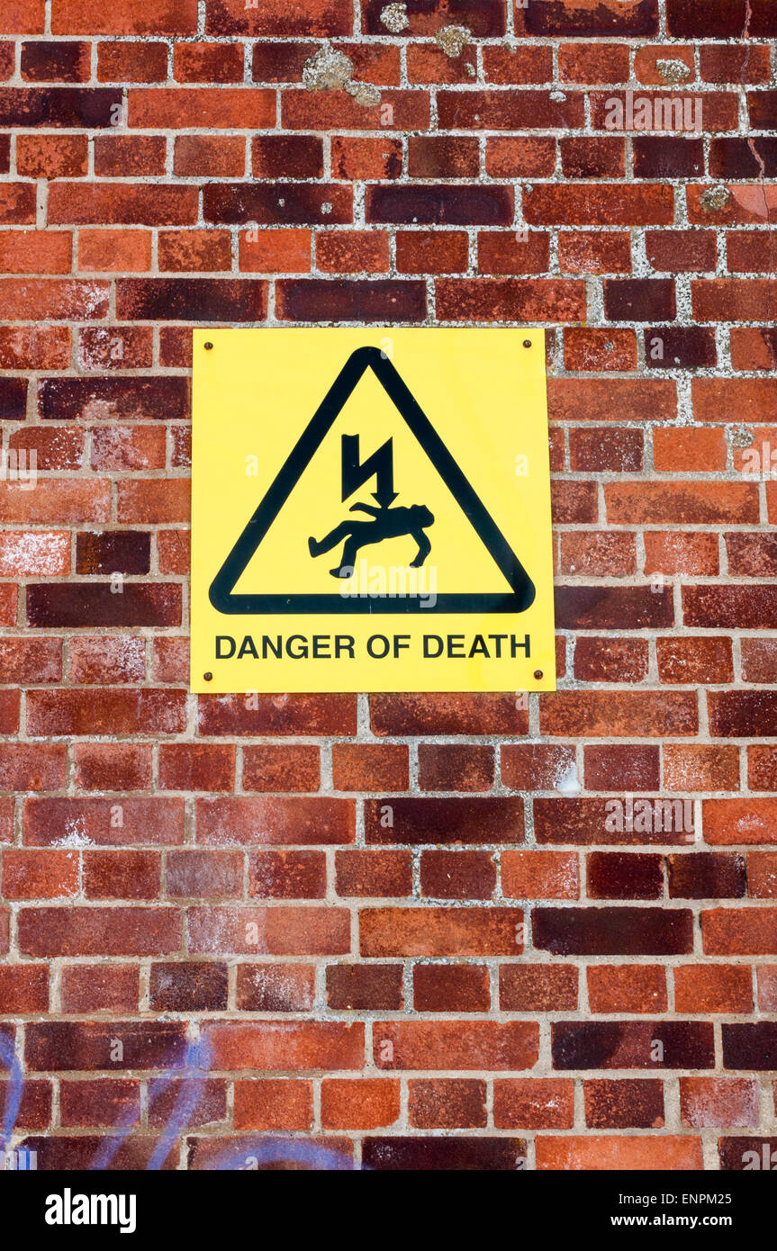 Warning sign on a wall 'Danger of Death' Stock Photo - Alamy