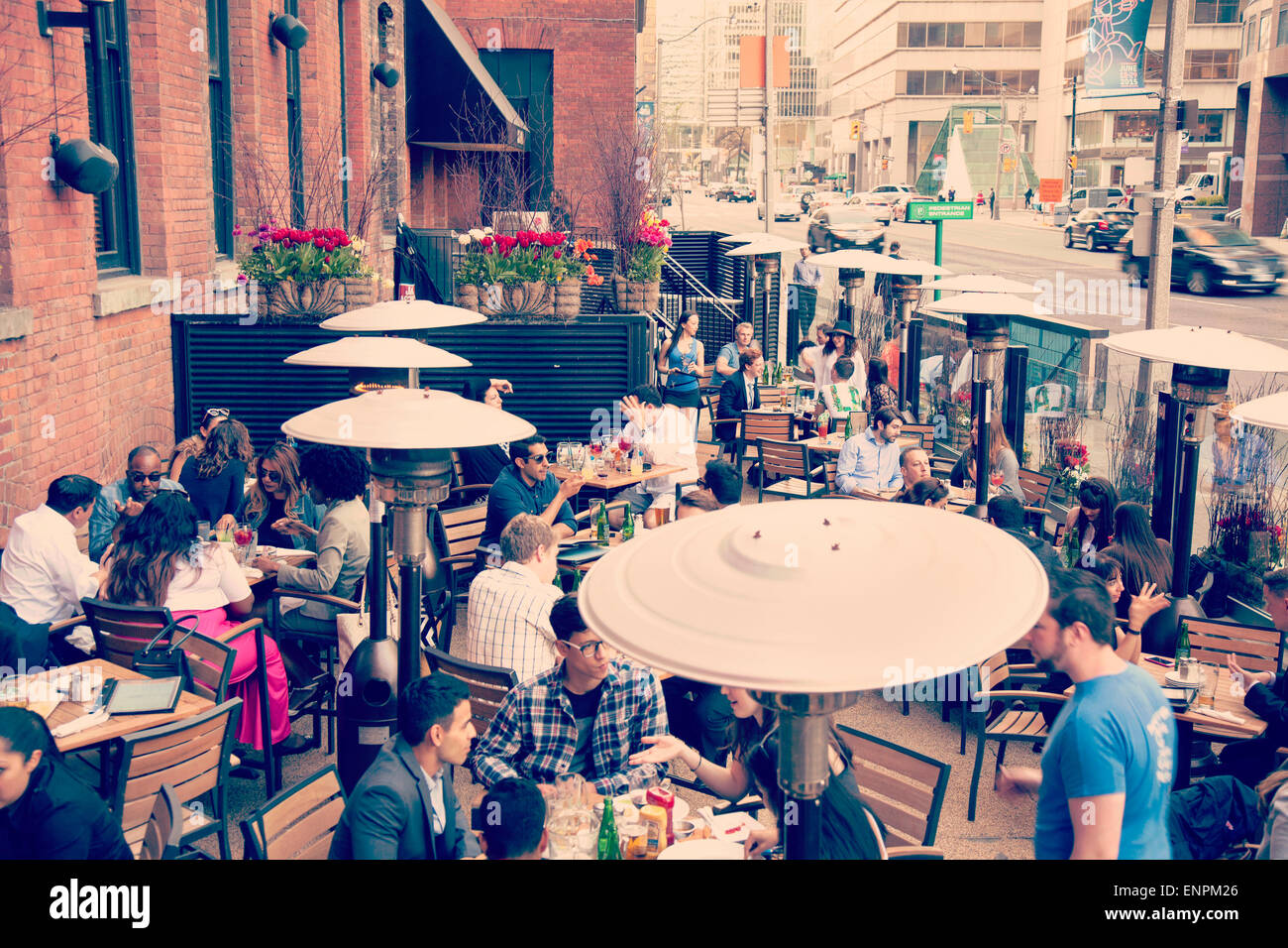 outdoor patio with people enjoying dinner Stock Photo - Alamy