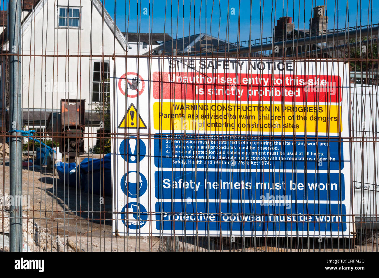 Warning signs at a construction site in UK Stock Photo - Alamy