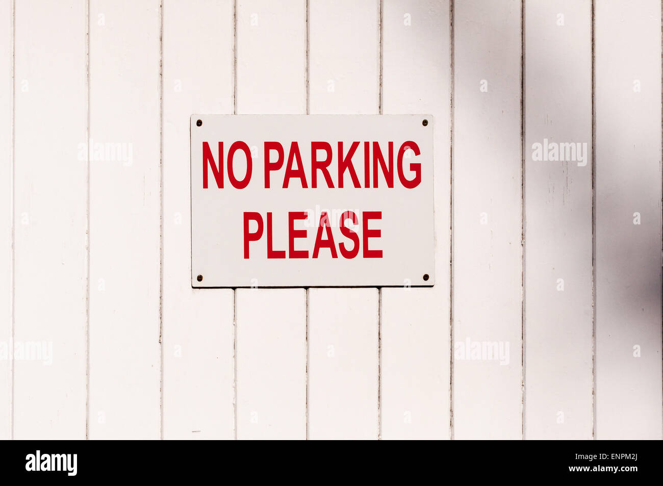 Polite warning Sign 'No Parking Please' mounted on a painted wooden ...