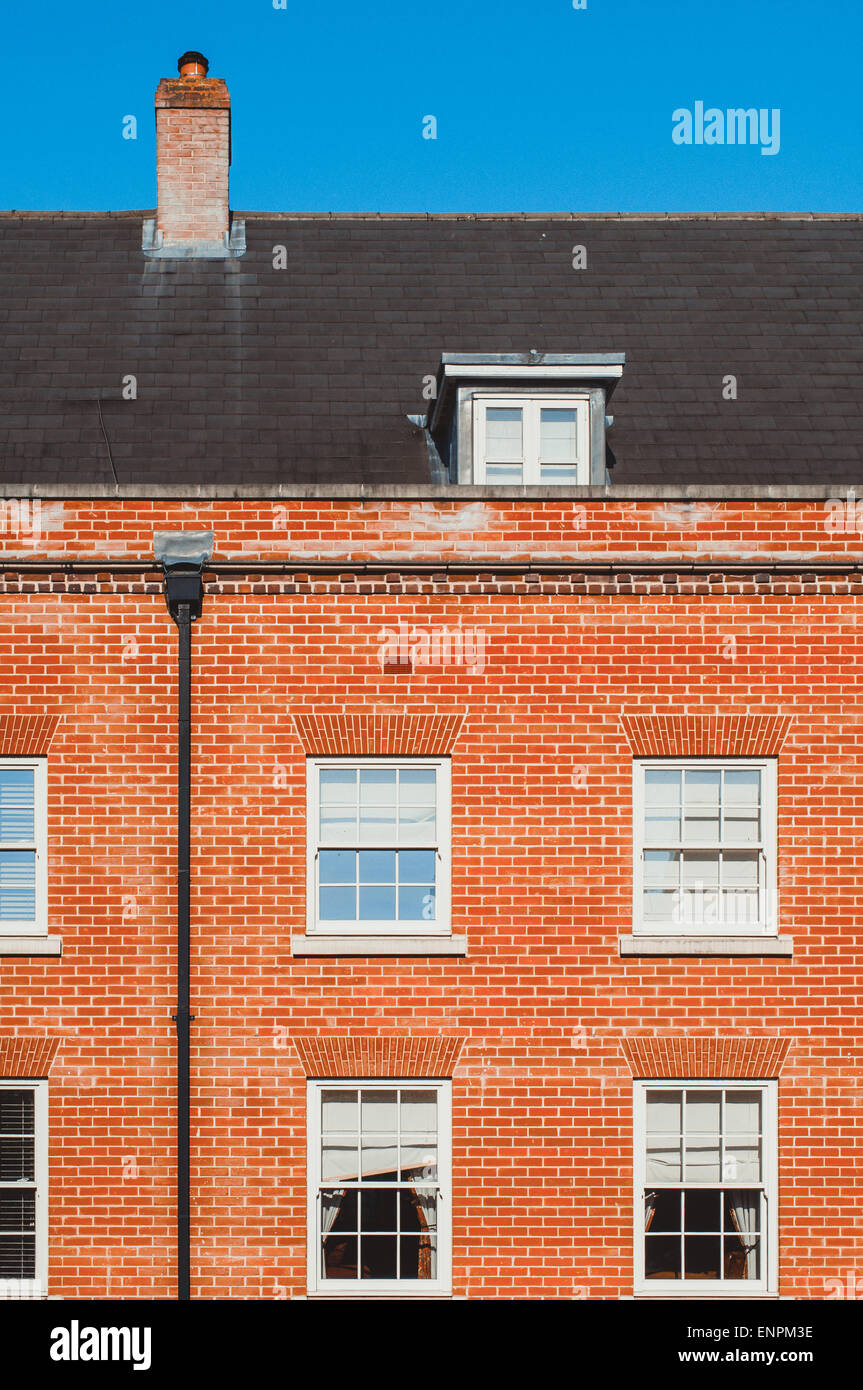 Closeup of a town house showing chimney and loft conversion Stock Photo ...
