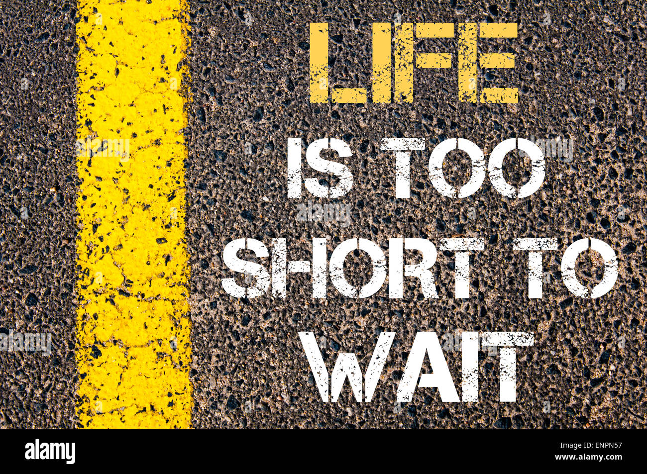 LIFE IS TOO SHORT TO WAIT motivational quote. Yellow paint line on the ...