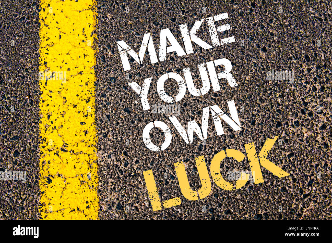 Make Your Own Luck motivational quote. Yellow paint line on the road ...
