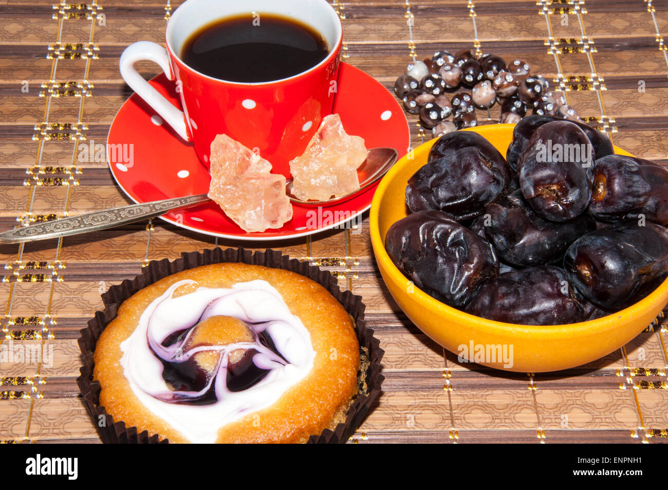 Coffee Cup dates cake and crystal sugar navat Stock Photo - Alamy