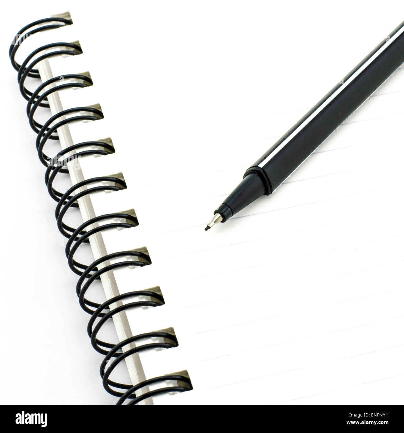 black pen with notebook isolated on white background Stock Photo - Alamy