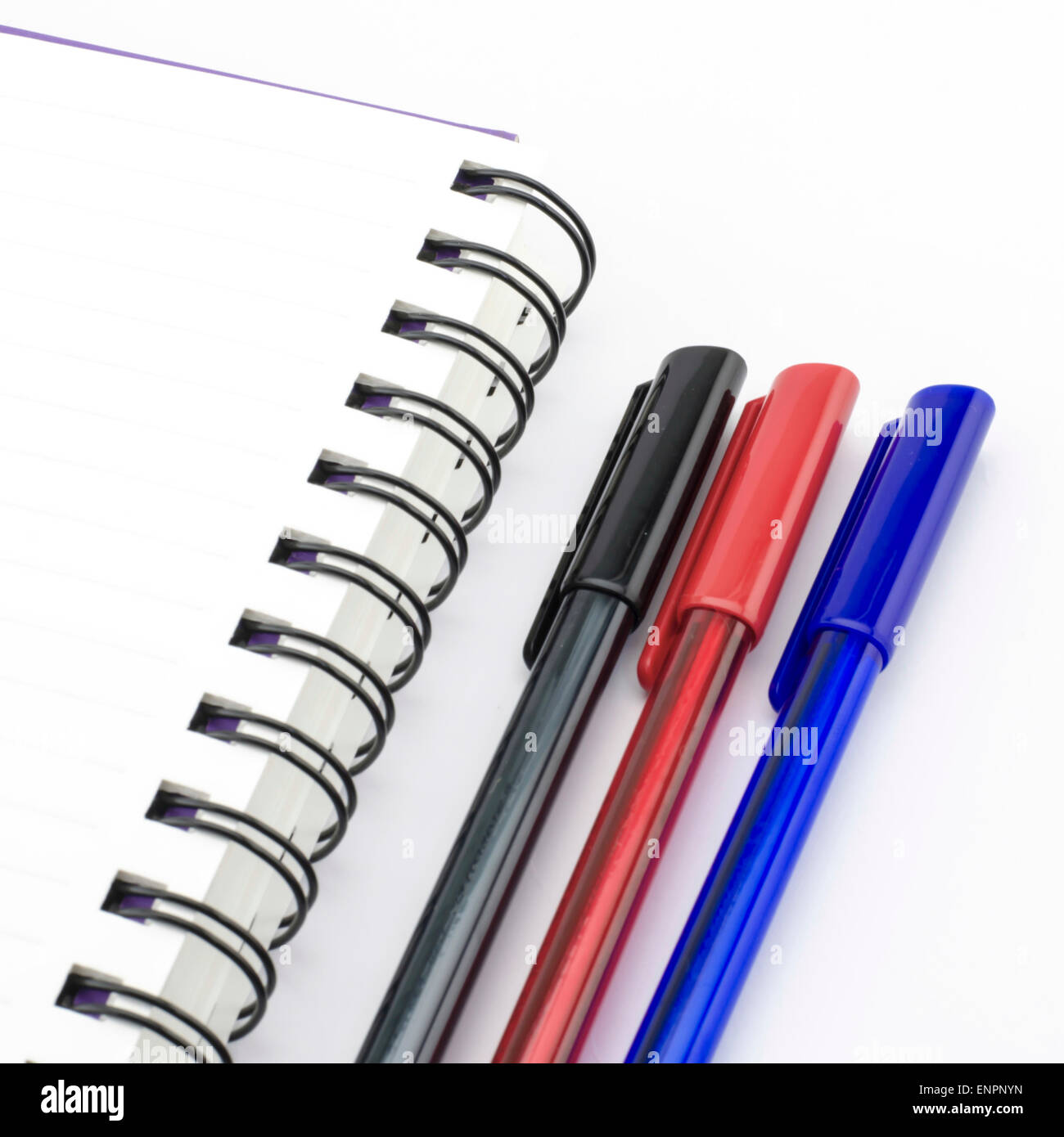 black red and blue pen with notebook isolated on white background Stock ...