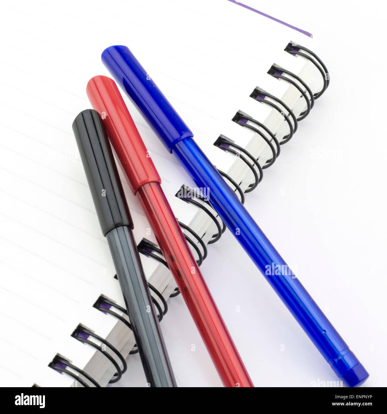 black red and blue pen with notebook isolated on white background Stock ...