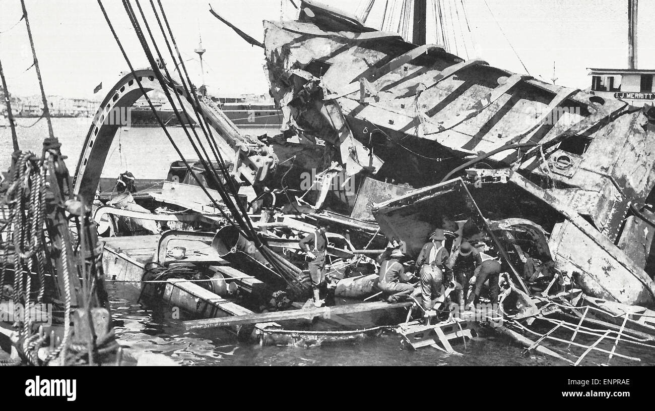 Wreckers at work on the midship section of the USS Maine after it ...
