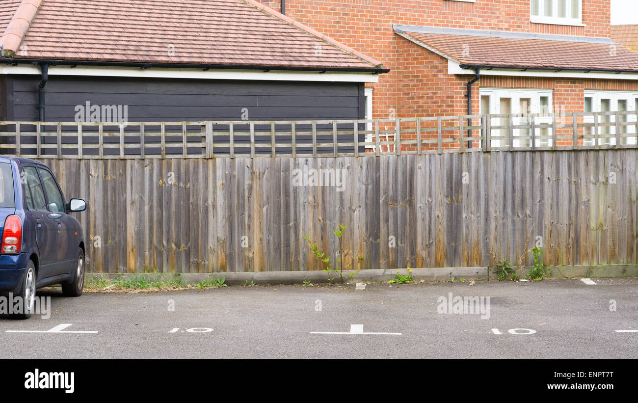 Residential Car Parking Space behind a wooden fence Stock Photo - Alamy