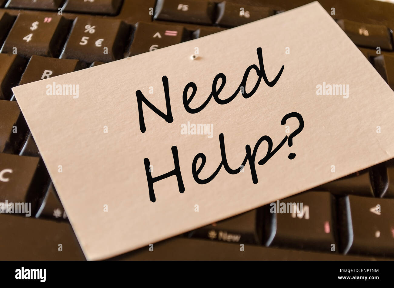 Need help Concept on black keyboard note Stock Photo - Alamy