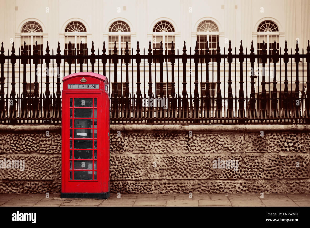 Red telephone box in street with historical architecture in London ...