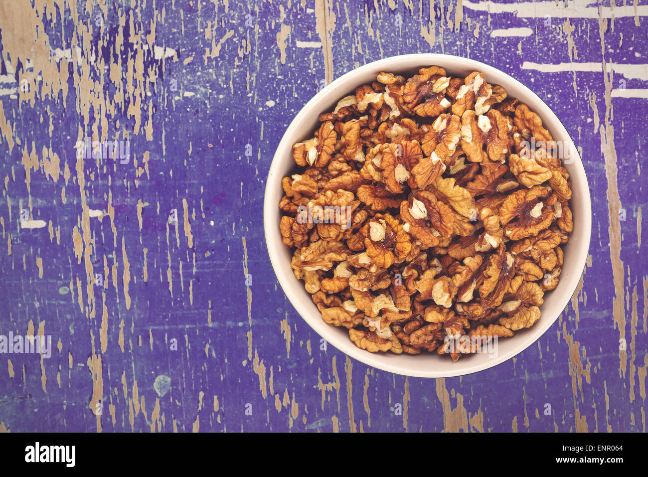 Peeled Walnut Kernels in Ceramic Bowl on Purple Rustic Wood Plank ...