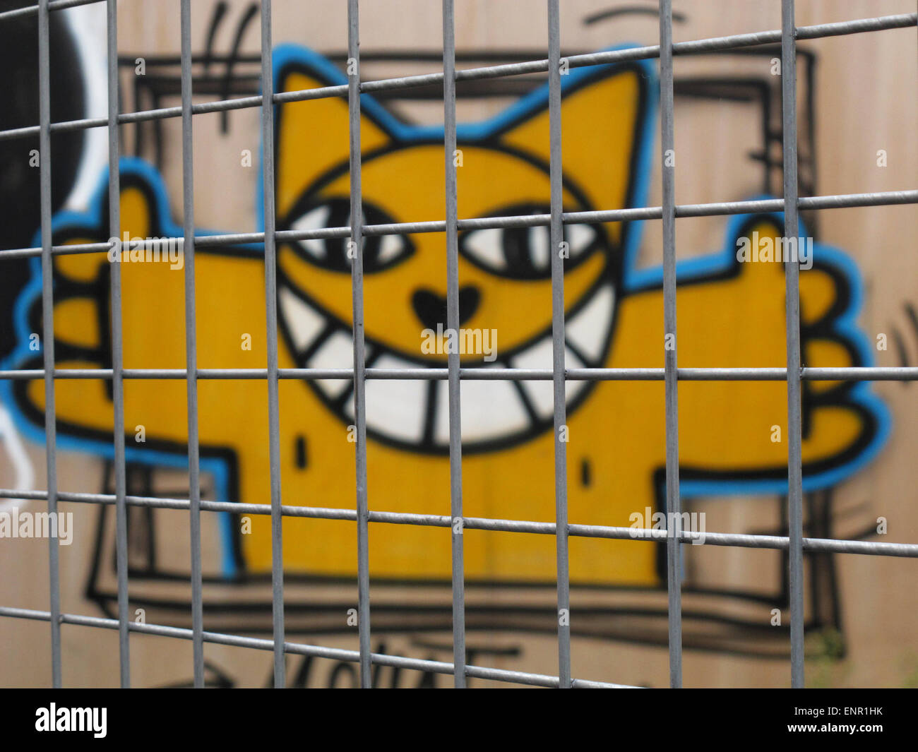 M chat behind the gate graffiti by thoma vuille artist hi-res stock ...
