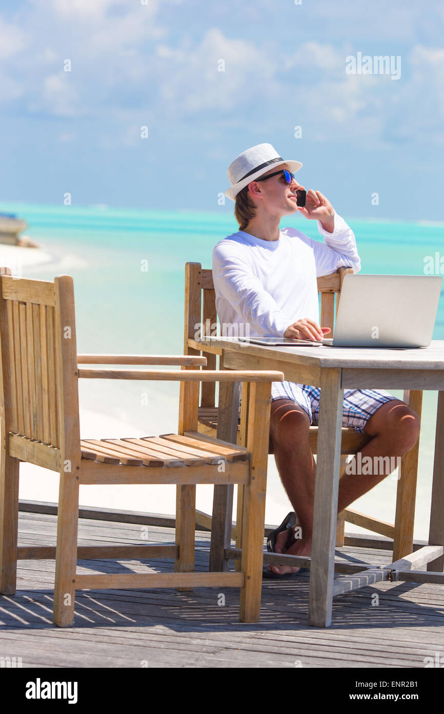 Business man calling by cell phone on white beach Stock Photo - Alamy