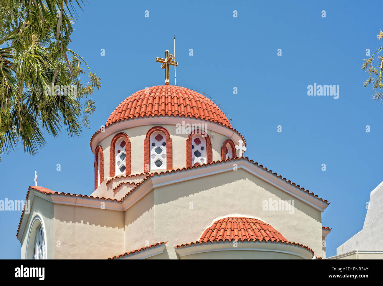 Greek Orthodox church in Crete with terracotta roof and cream walls ...
