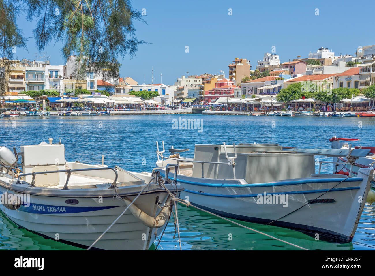 Two fishing boats moored in a lake in a tourist spot in Crete Stock ...
