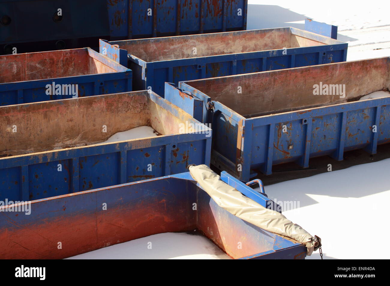 Collection of empty blue containers in winter Stock Photo - Alamy