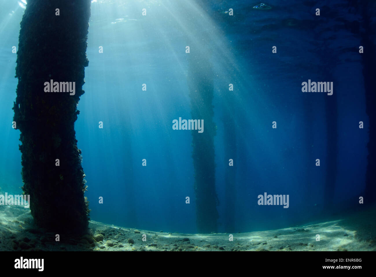 Beautiful sun rays underneath the Jetty of Ambon Maluku with the ...