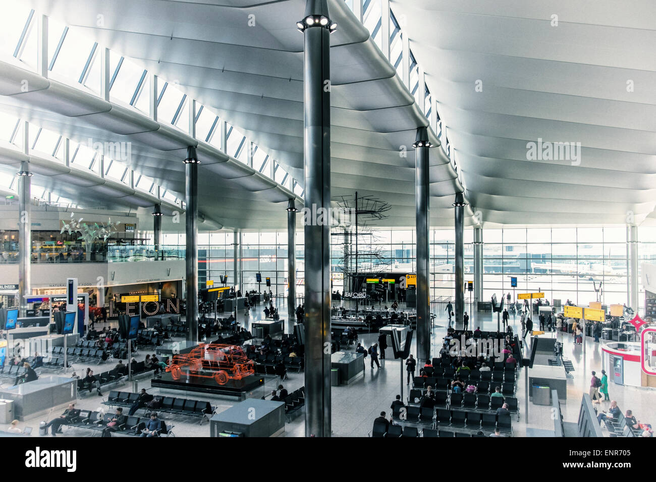 London Heathrow Airport Terminal 2 departures hall - passengers wait in ...