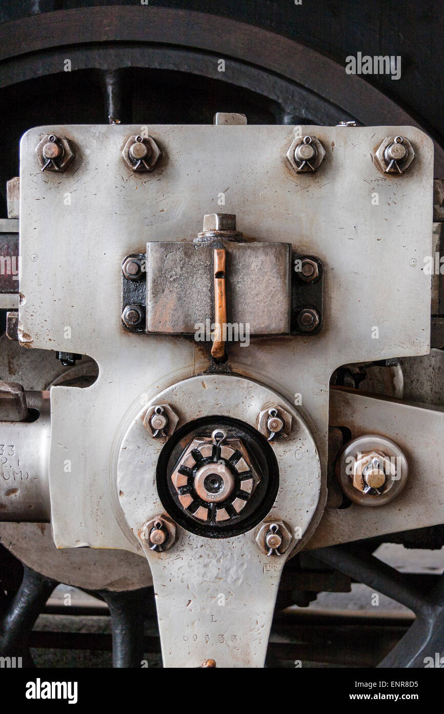 Close up of a cast iron connecting crankpin on the wheel of a steam ...