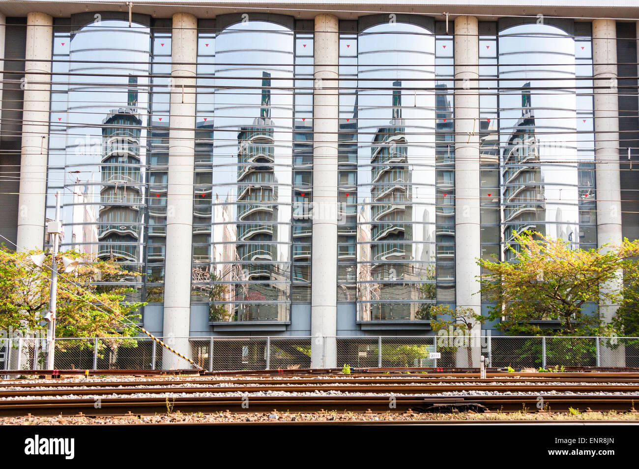 Kyoto. Imposing highly reflective glass fronted office façade ...