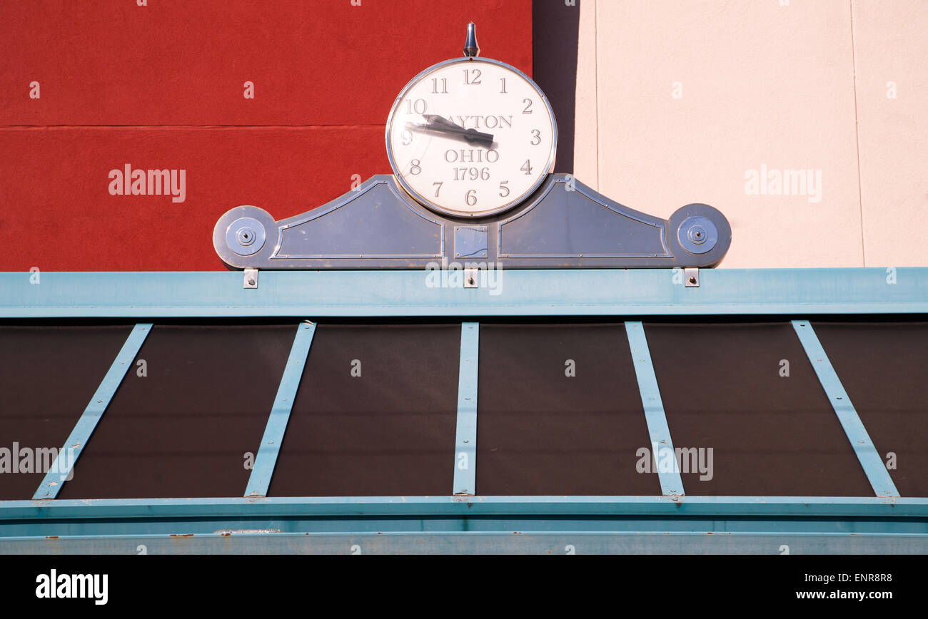 Clock on top of a bus stop bench station Stock Photo - Alamy