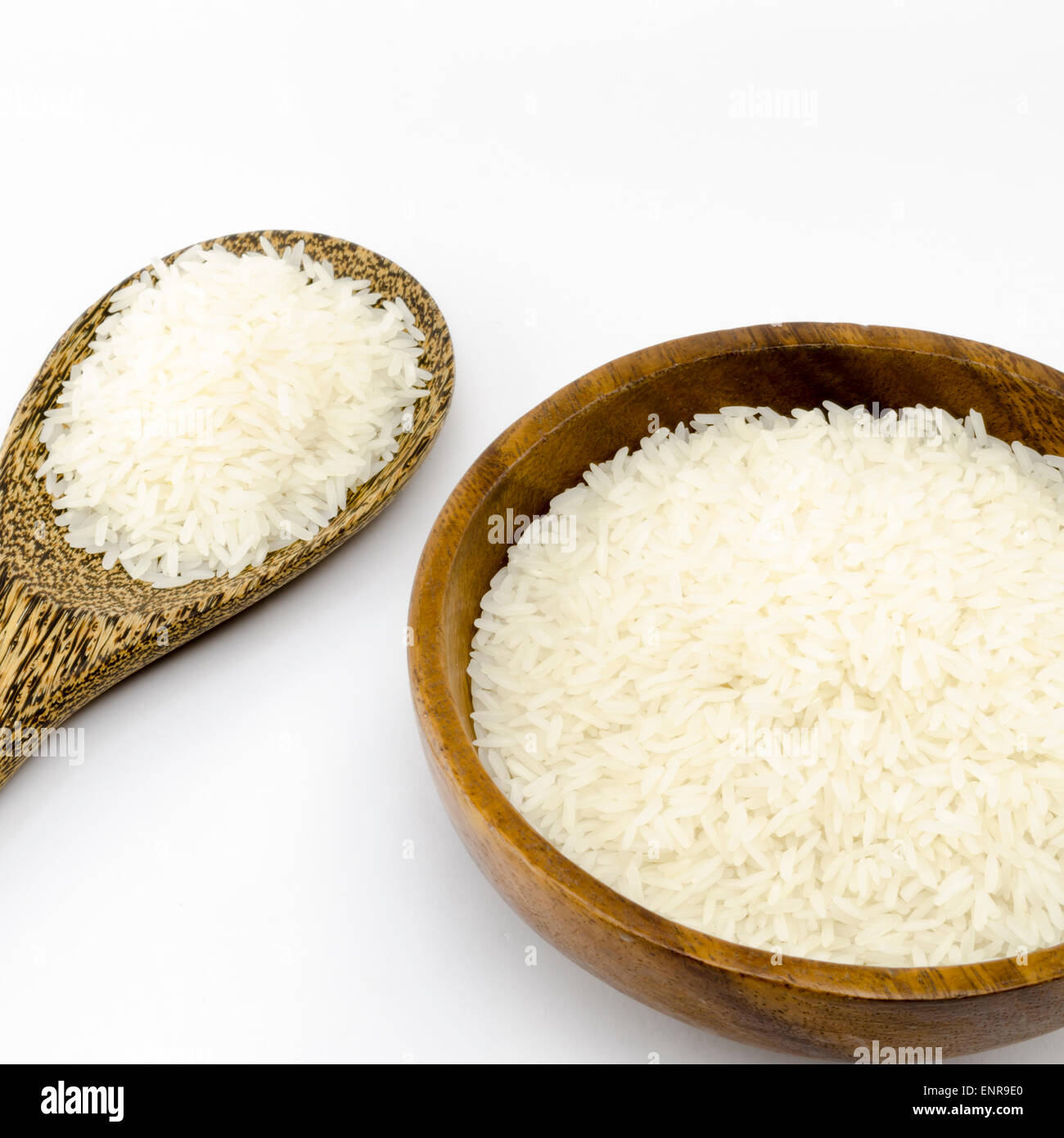 rice on wood bowl isolated on white background Stock Photo - Alamy