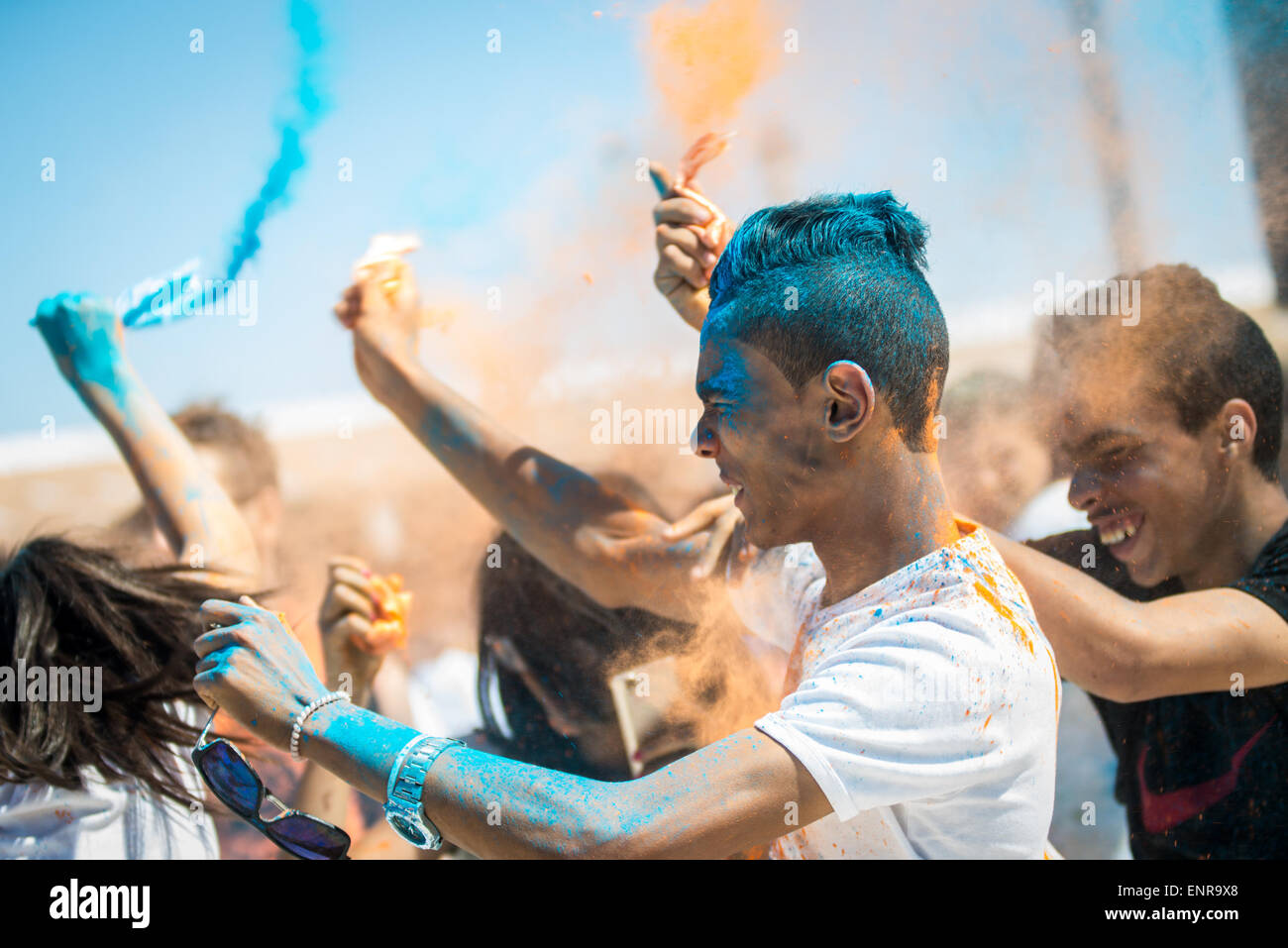 Tunis, Tunisia. 10th May, 2015. Runners spray color powder over each ...