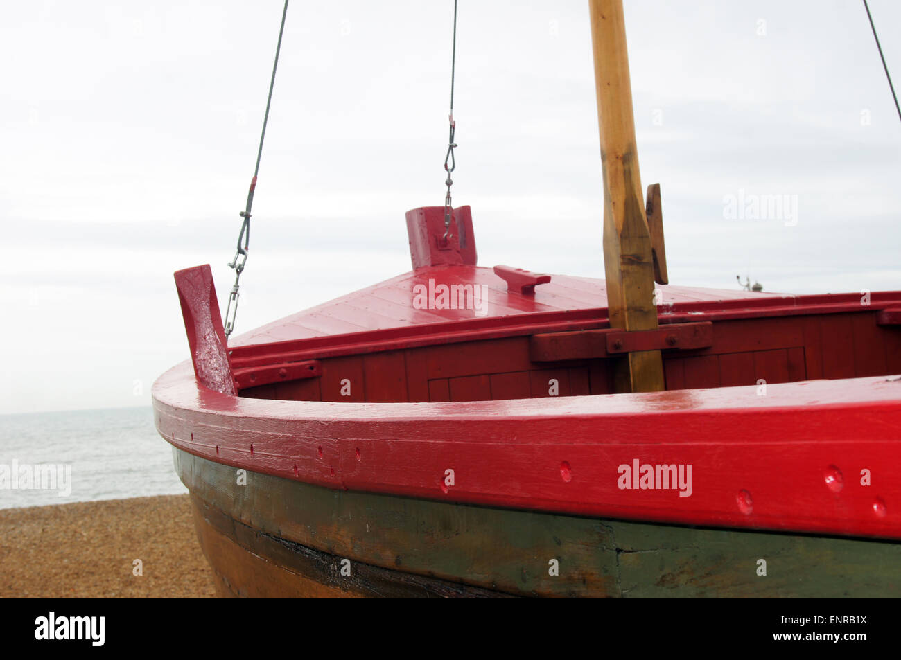 Red boat on the beach Stock Photo - Alamy