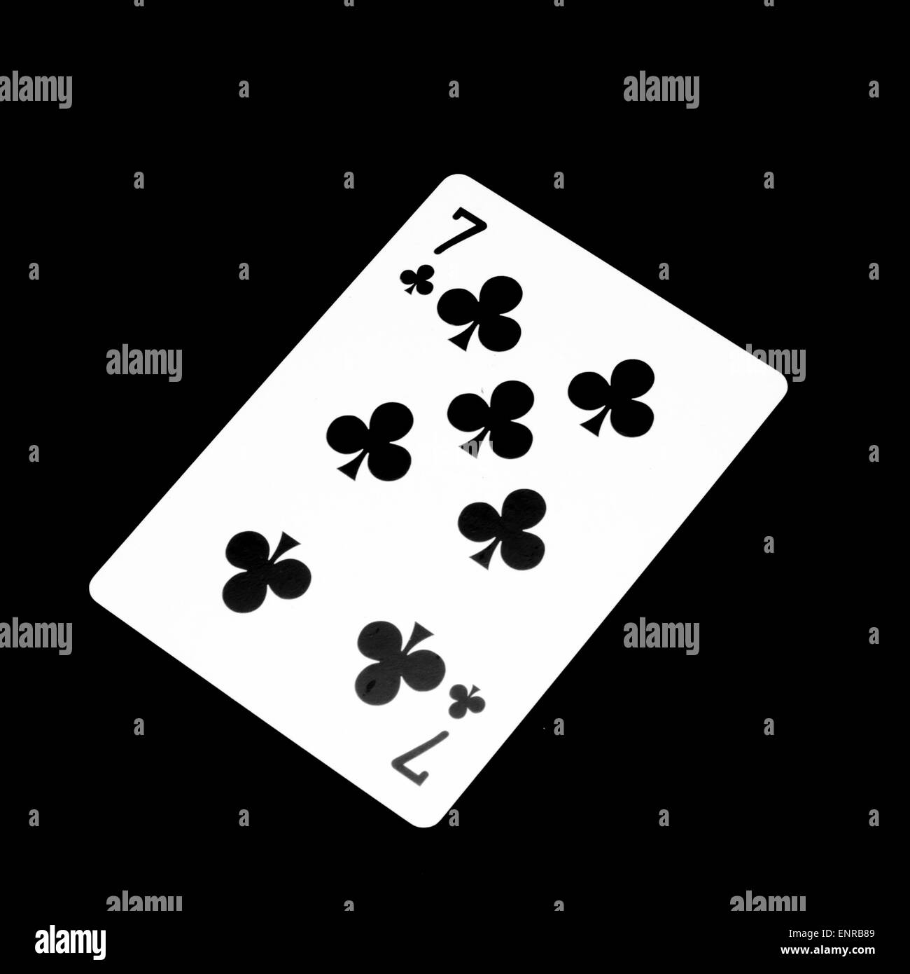 number seven clover card isolated on black background Stock Photo - Alamy