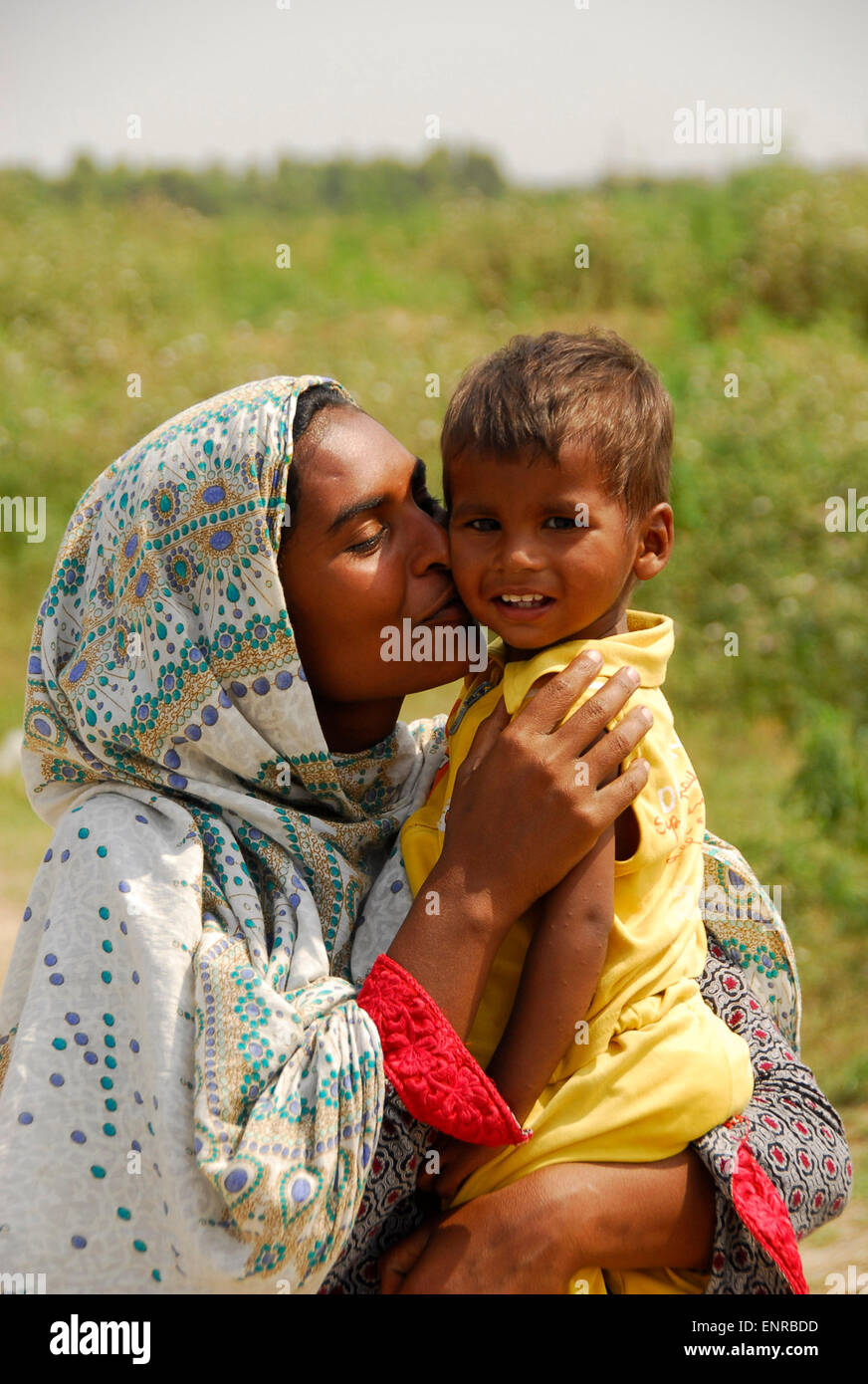 Islamabad. 10th May, 2015. A Pakistani mother kisses her child in ...