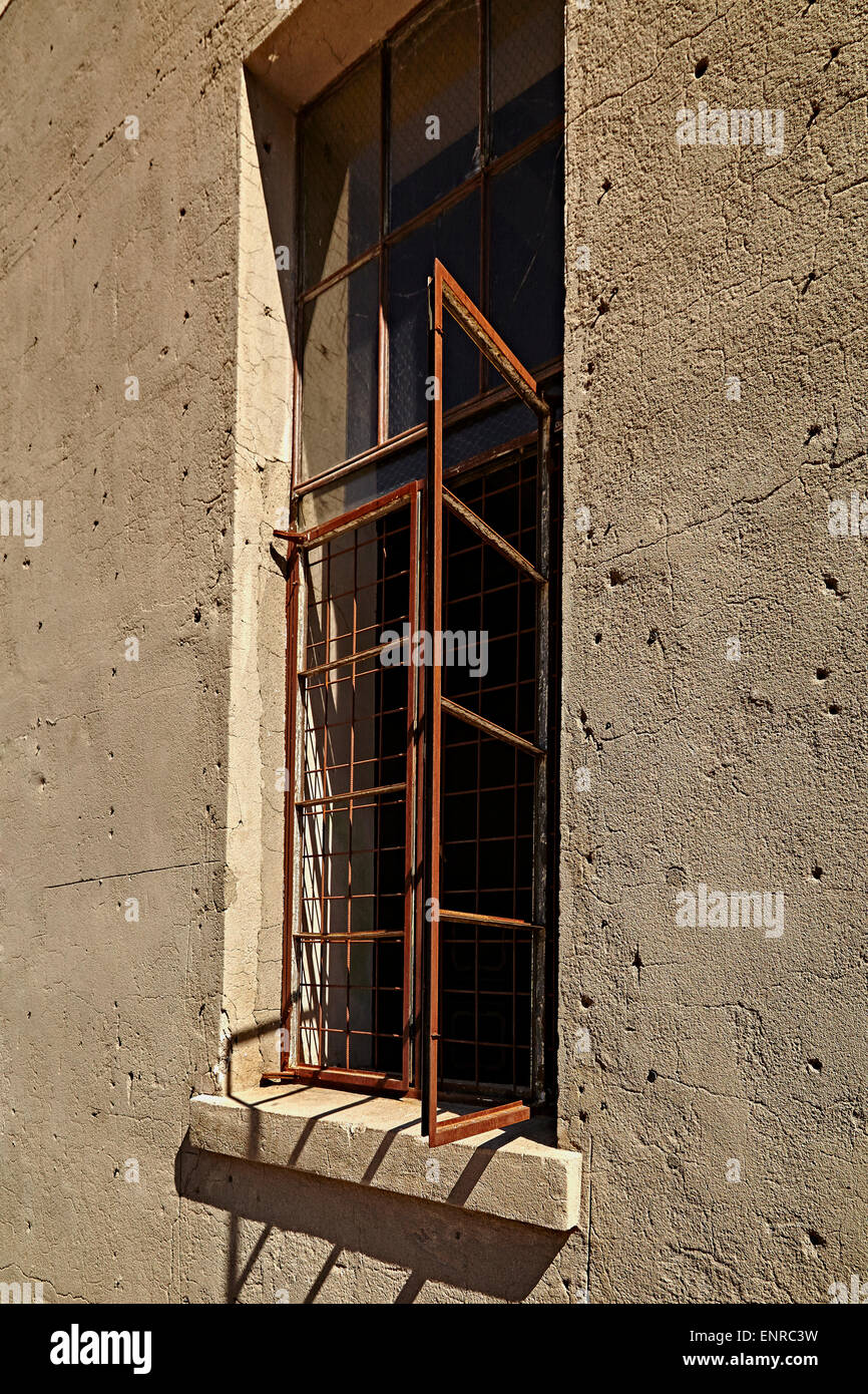 Abandoned building with rusty window frame open Stock Photo - Alamy