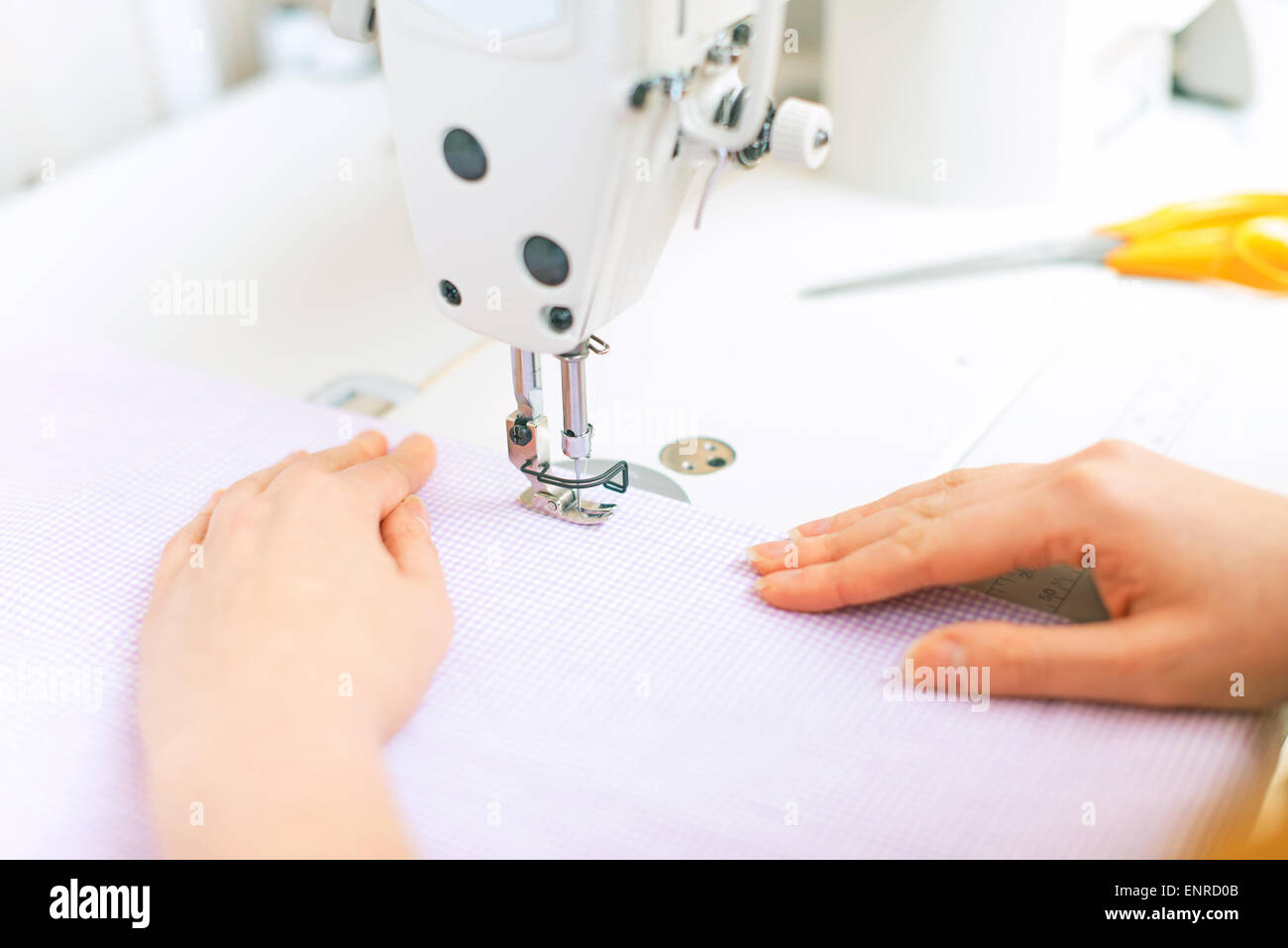 Woman's hands working on sewing machine Stock Photo - Alamy