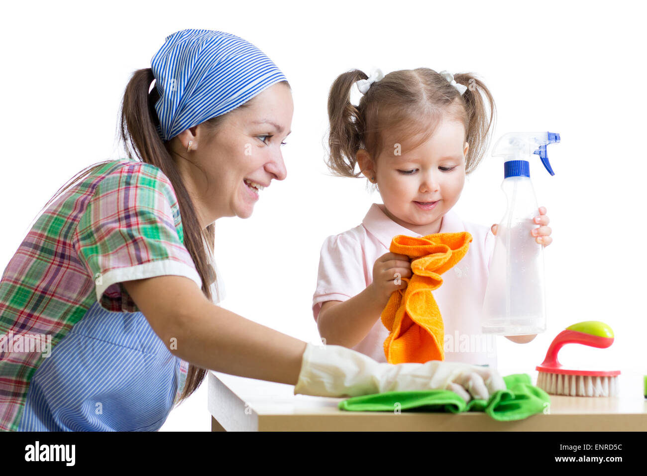 cute young mother teaches daughter child cleaning room Stock Photo - Alamy