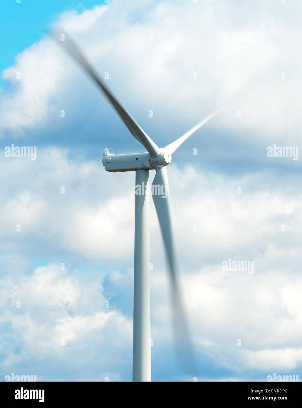 Moving wind turbine over blue sky Stock Photo - Alamy
