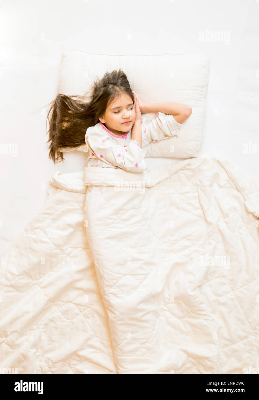 Isolated shot from top of cute girl sleeping in bed Stock Photo - Alamy