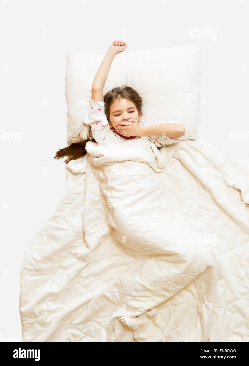 Isolated shot of cute girl yawning in bed at morning Stock Photo - Alamy