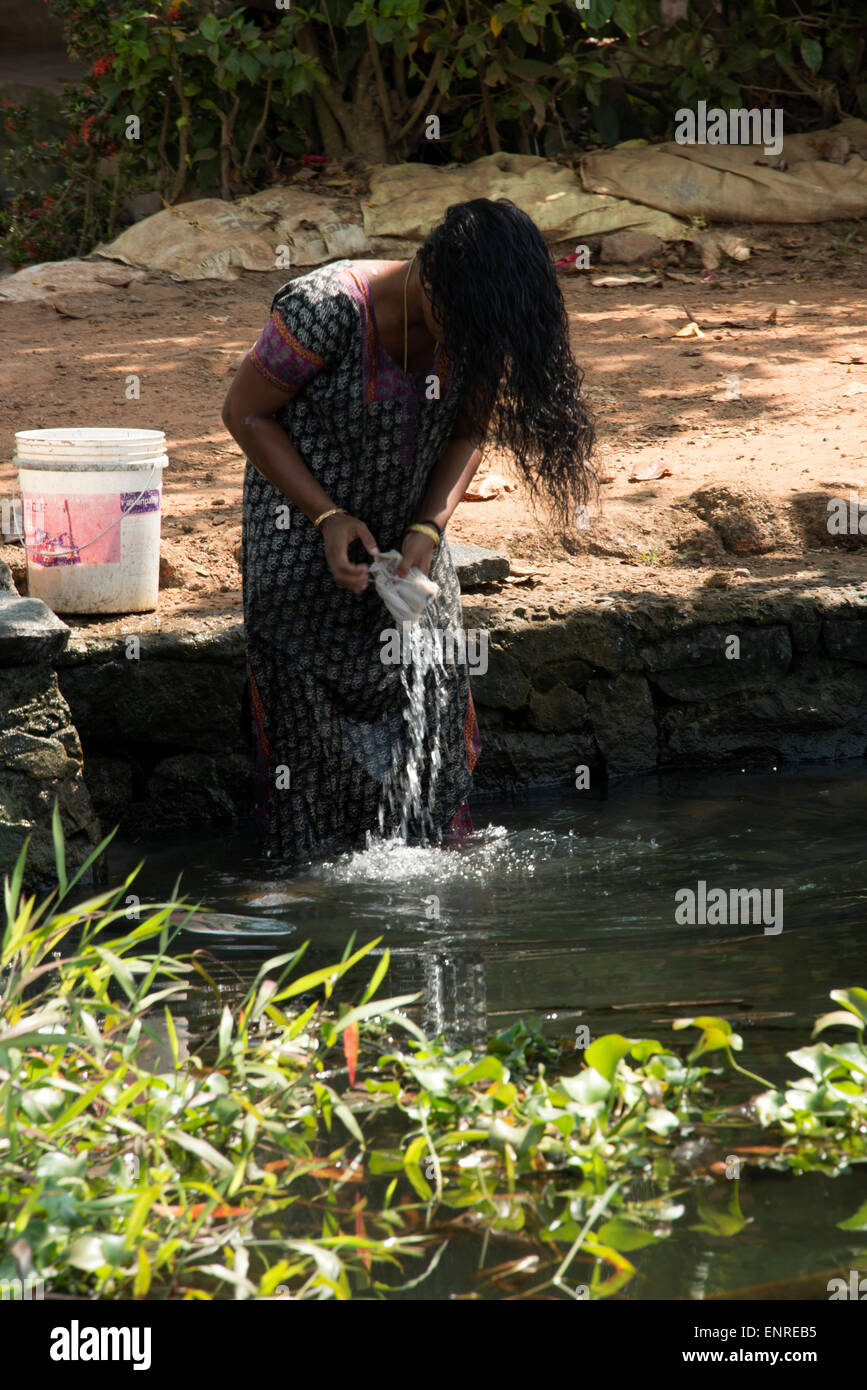 Indian woman washing clothes hi-res stock photography and images - Alamy
