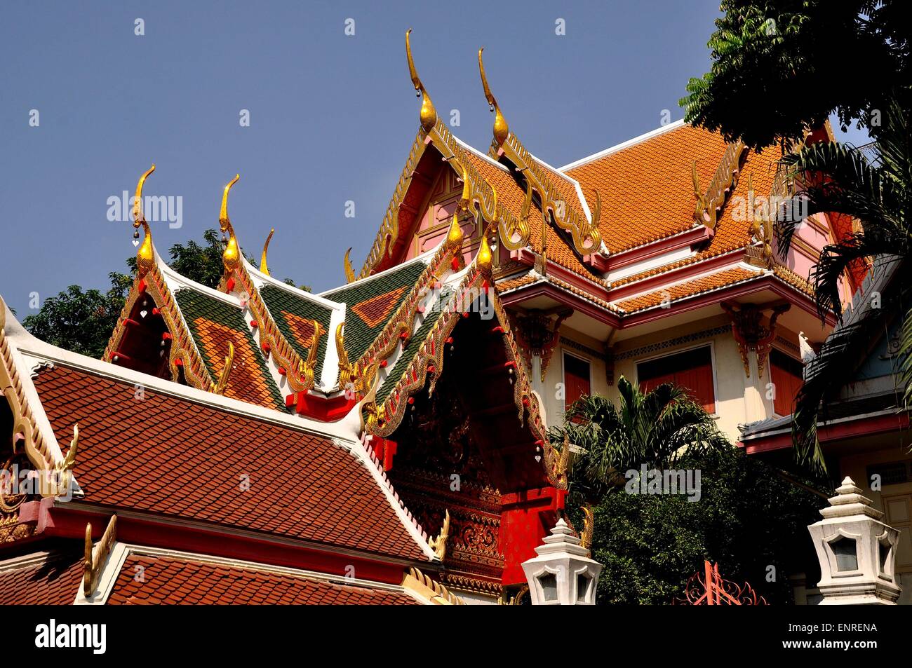 Bangkok, Thailand: Tiled roofs with gilded chofah ornaments at Wat ...