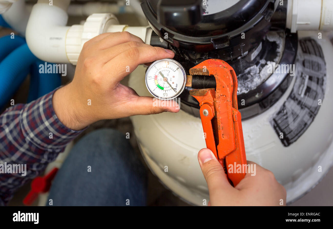 Closeup shot of plumber installing manometer on pipe Stock Photo - Alamy
