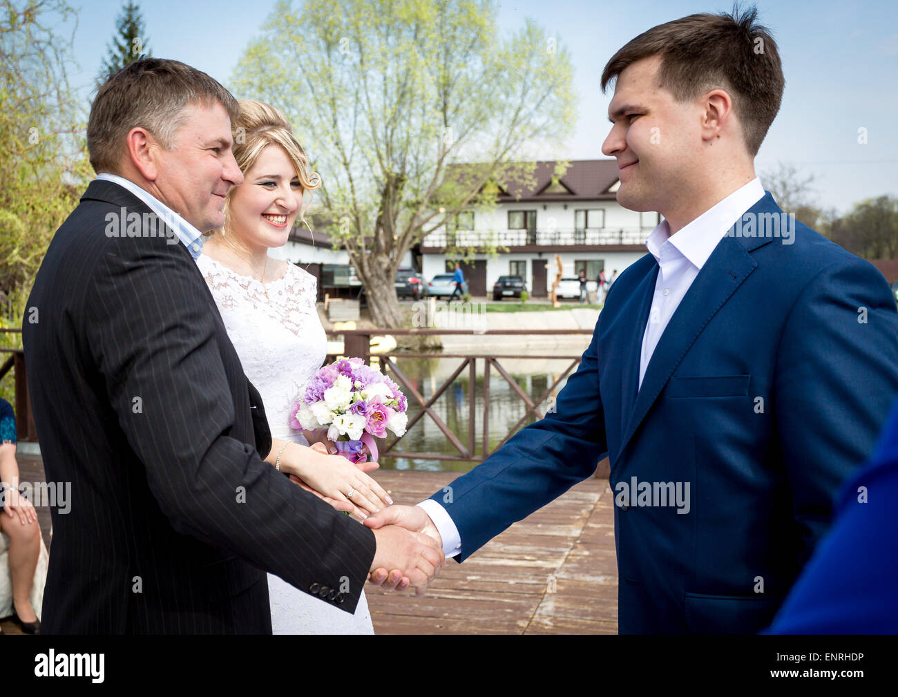 Handshake of brides hi-res stock photography and images - Alamy