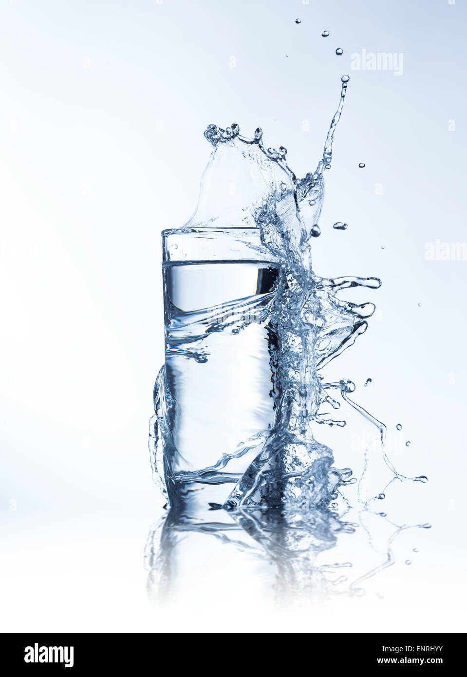 Fresh drink with splashing stream of water shot on freeze motion Stock ...
