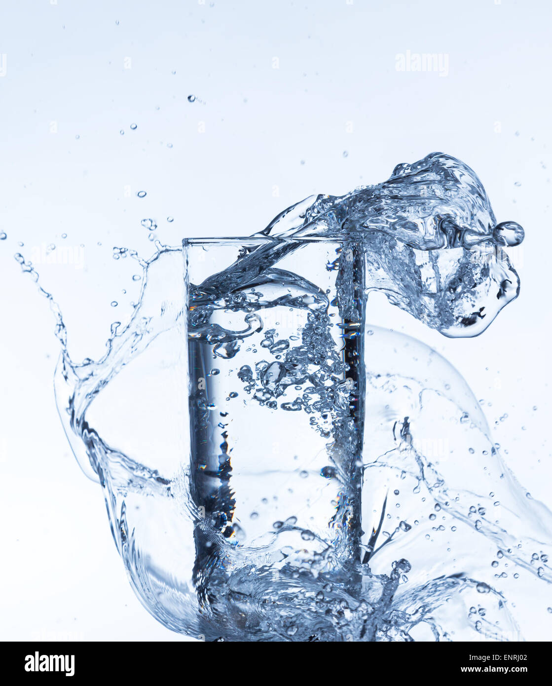 Fresh drink with splashing stream of water shot on freeze motion Stock ...