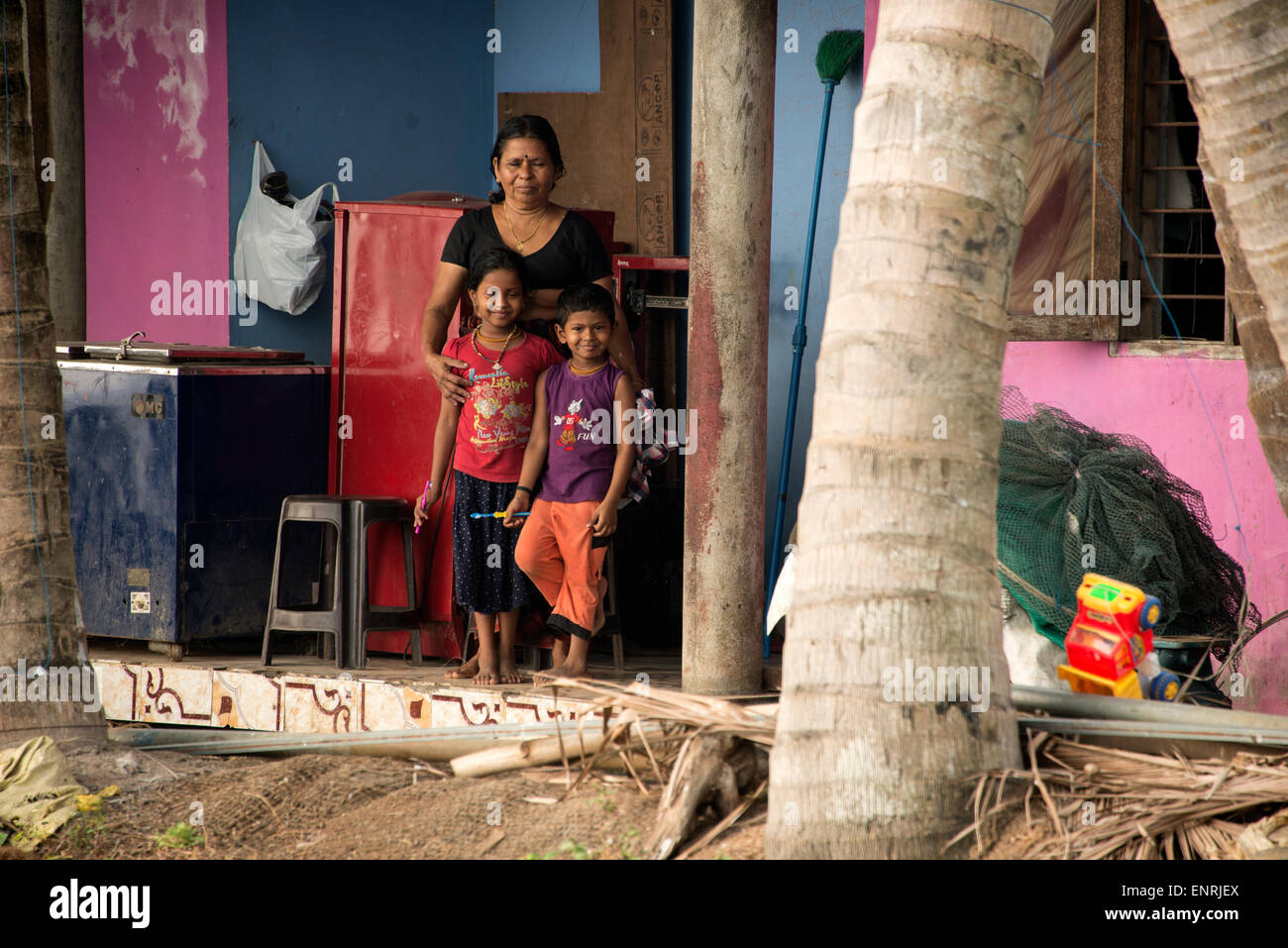 An Indian family of a fisherman at their home on the banks of the ...