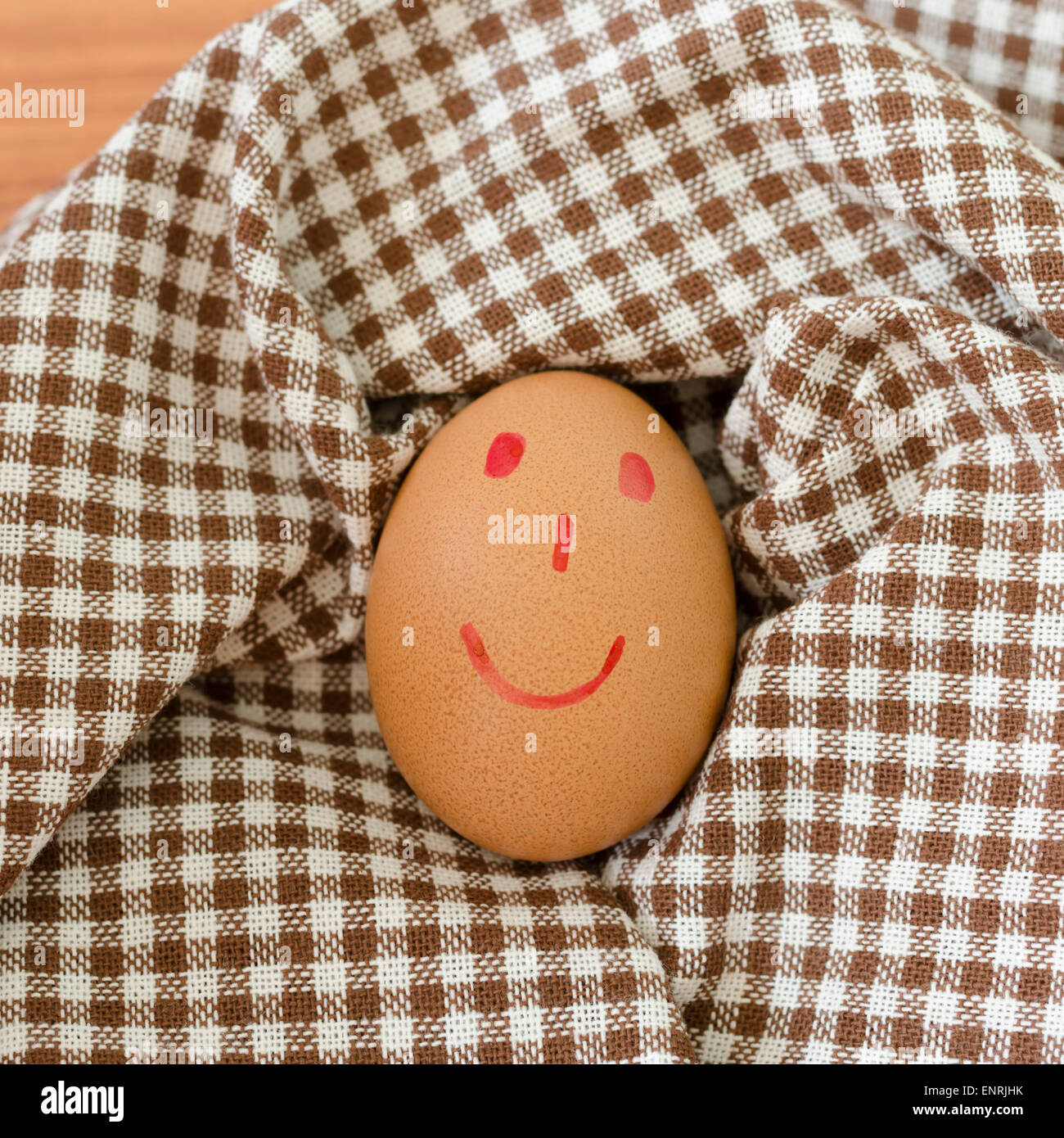 smile love egg couple in brown kitchen towel on wood table Stock Photo ...